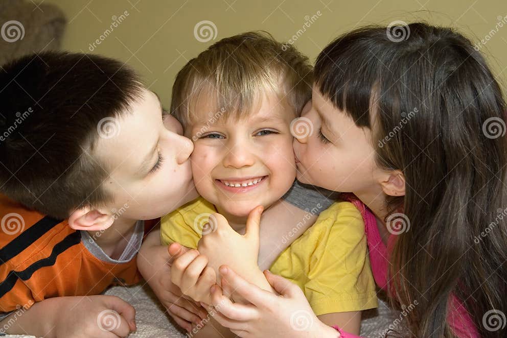 Kiss on the cheek stock image. Image of hugging, joking - 2053971