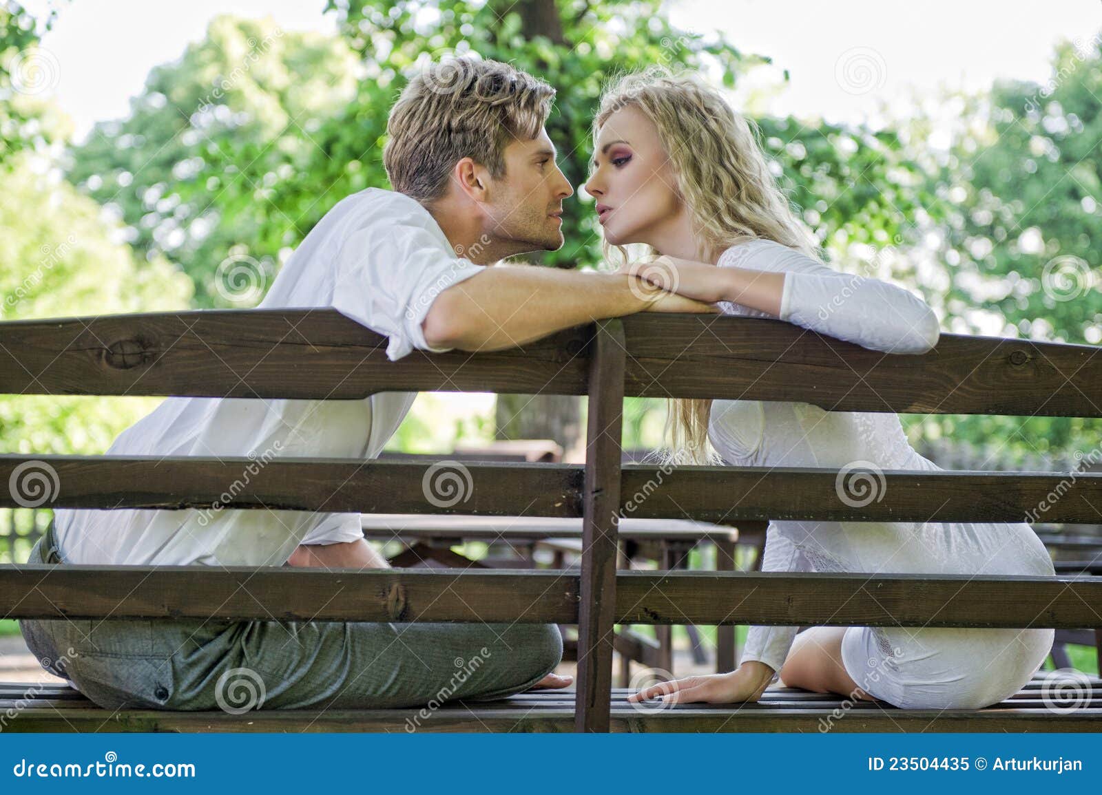 Kissing Couple on the Bench Stock Image - Image of garden, happiness ...