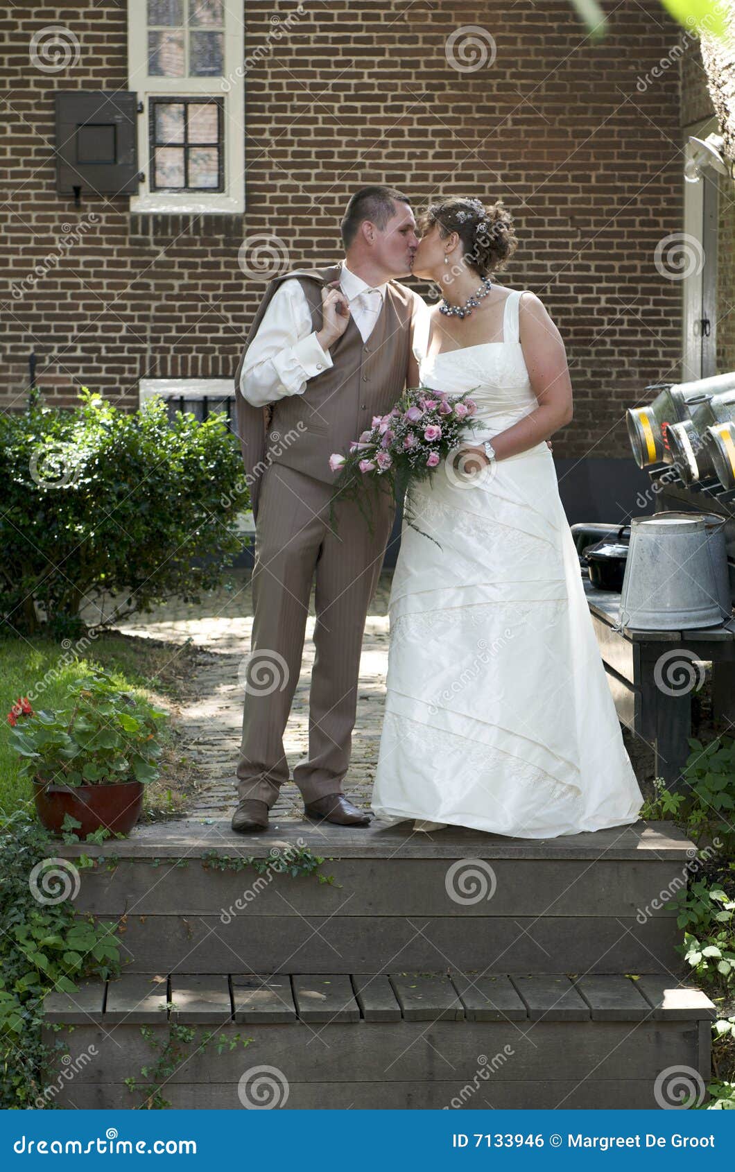 Kissing wedding couple stock photo. Image of kiss, groom - 7133946
