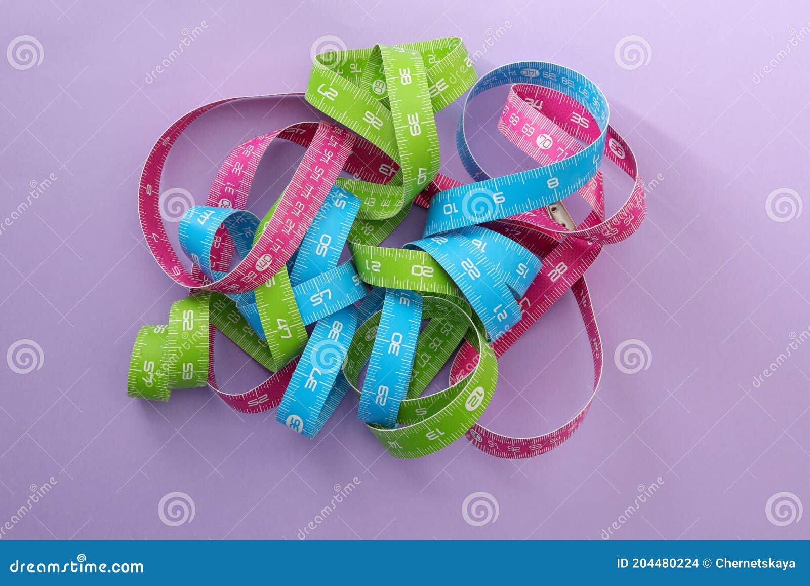 Kit of Different Measuring Tapes on Purple Background, Flat Lay Stock ...