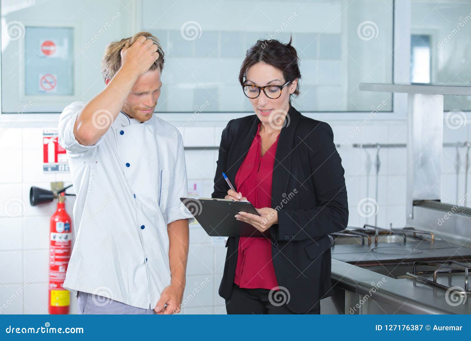 Kitchen Chef Being Supervised by Restaurant Manager Stock Image - Image ...