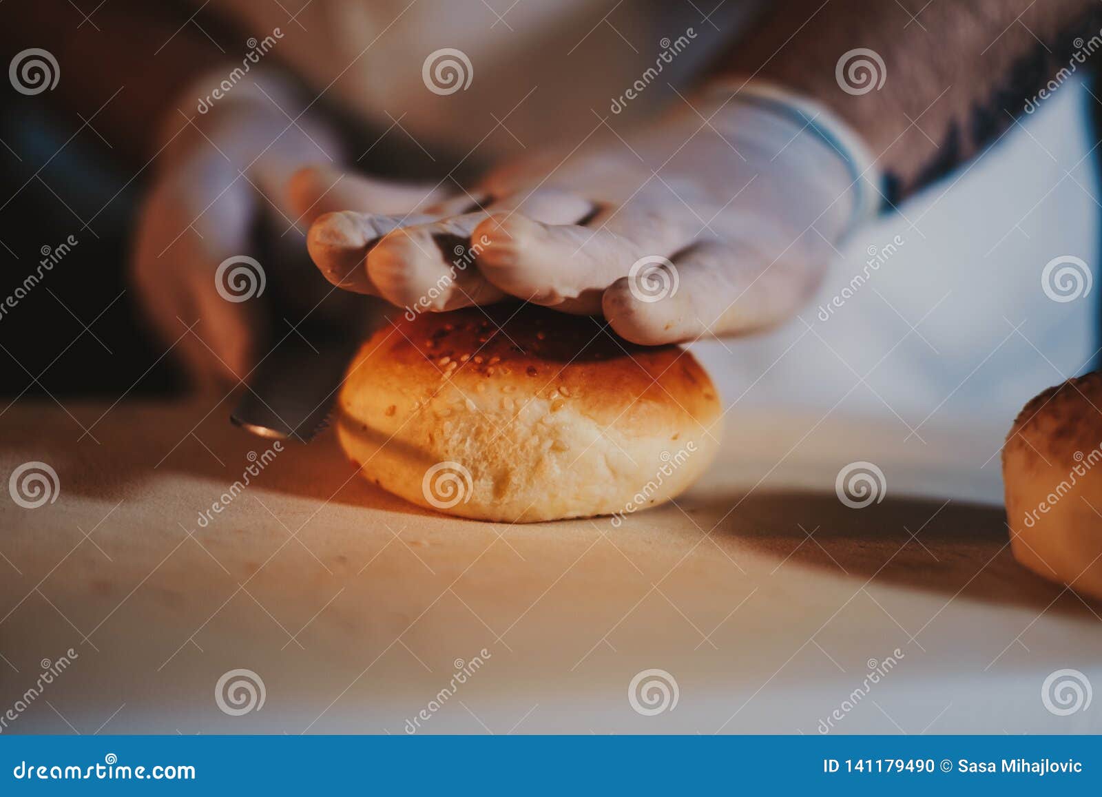 Kitchen Chef Start Cutting Hamburger Bun with a Knife Stock Photo ...
