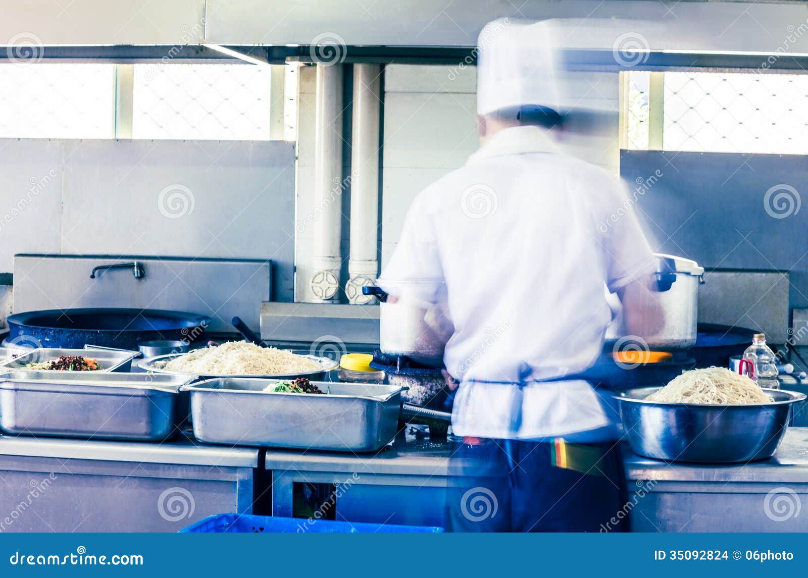 Kitchen of a Chinese Restaurant Stock Photo - Image of blurred, chefs ...
