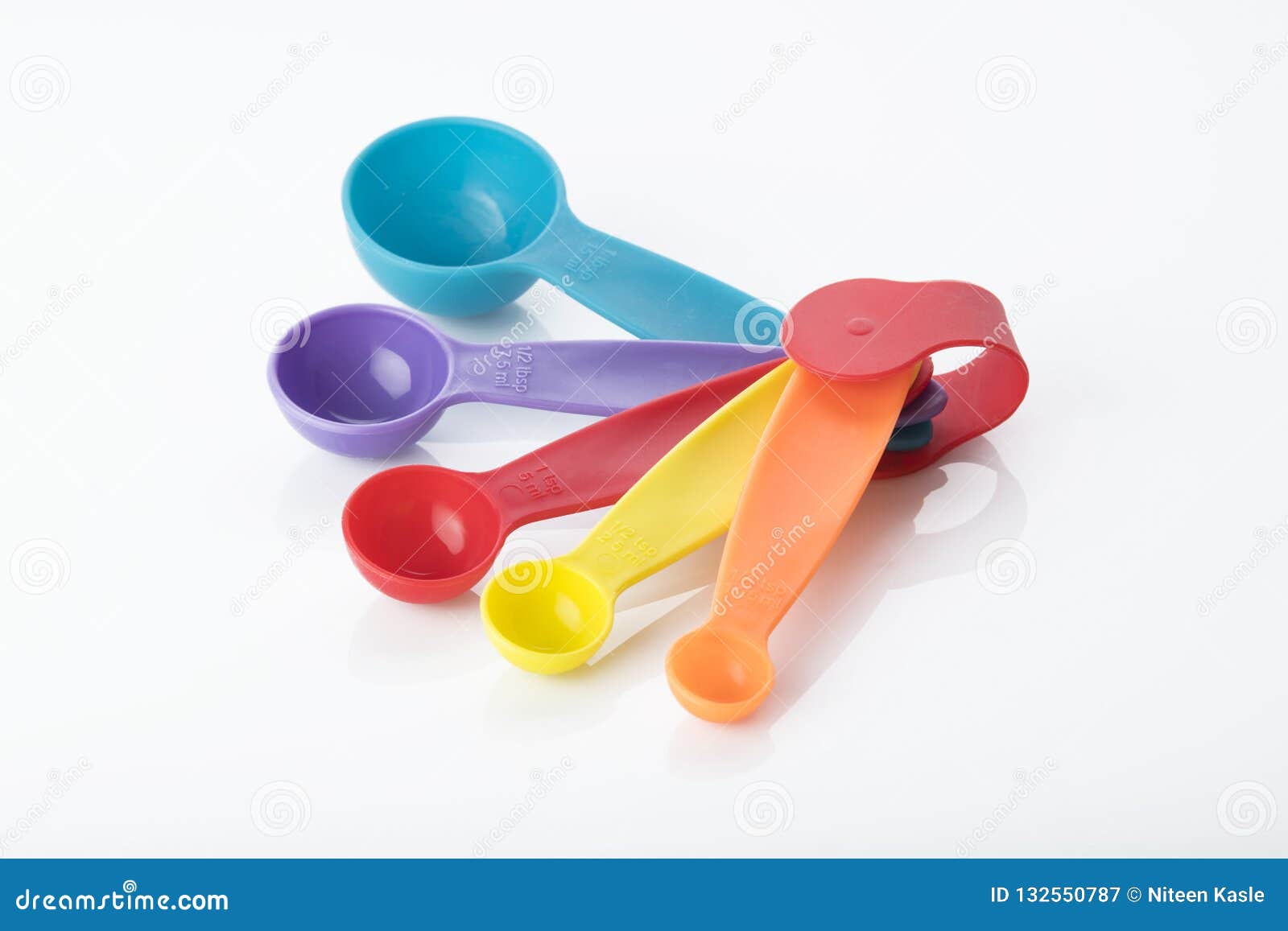 Kitchen: Close Up of Multi Colored Measuring Spoons Isolated on White ...