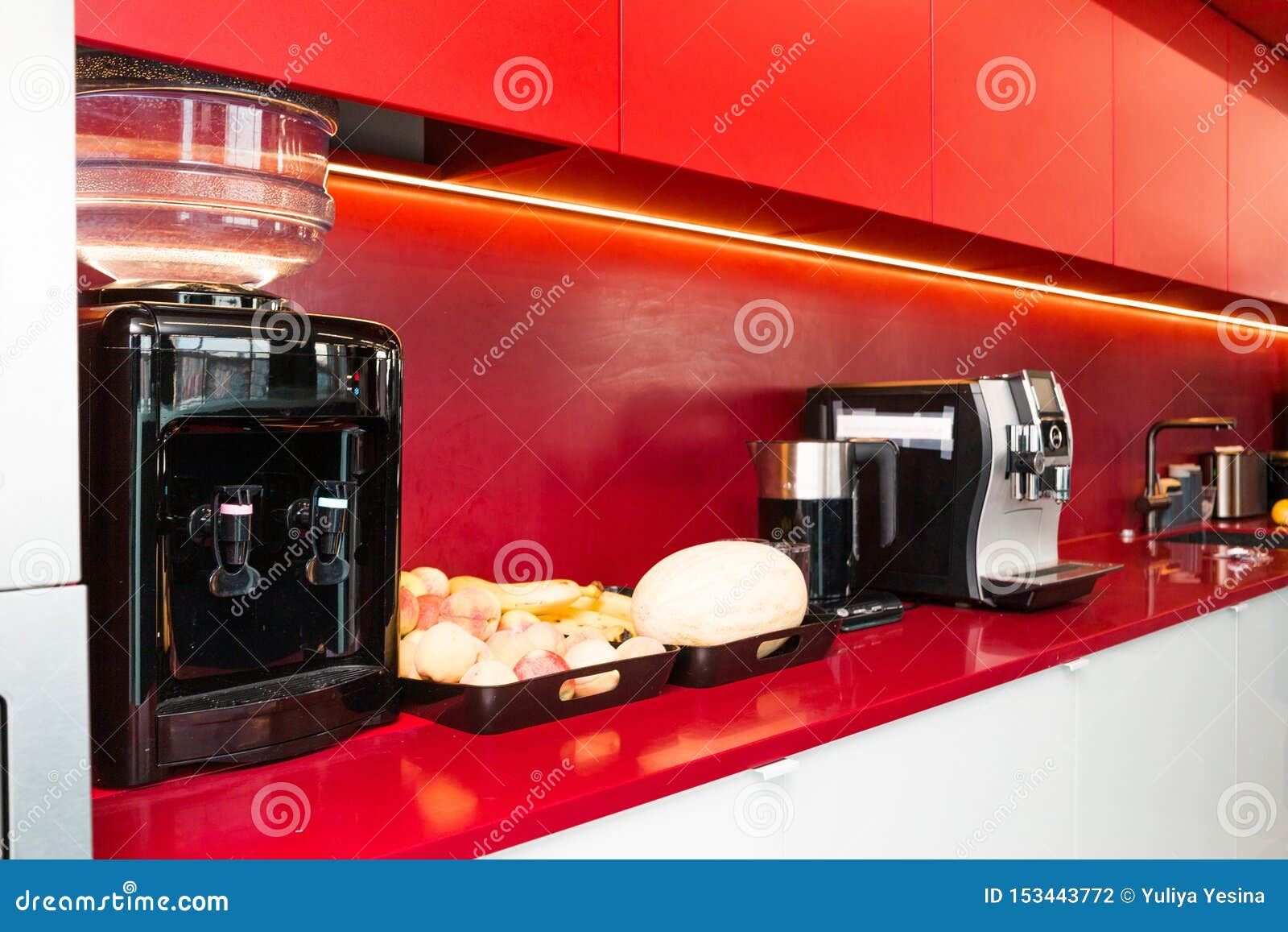 Kitchen with Coffee Machine, Cooler and Fruit Stock Photo - Image of ...