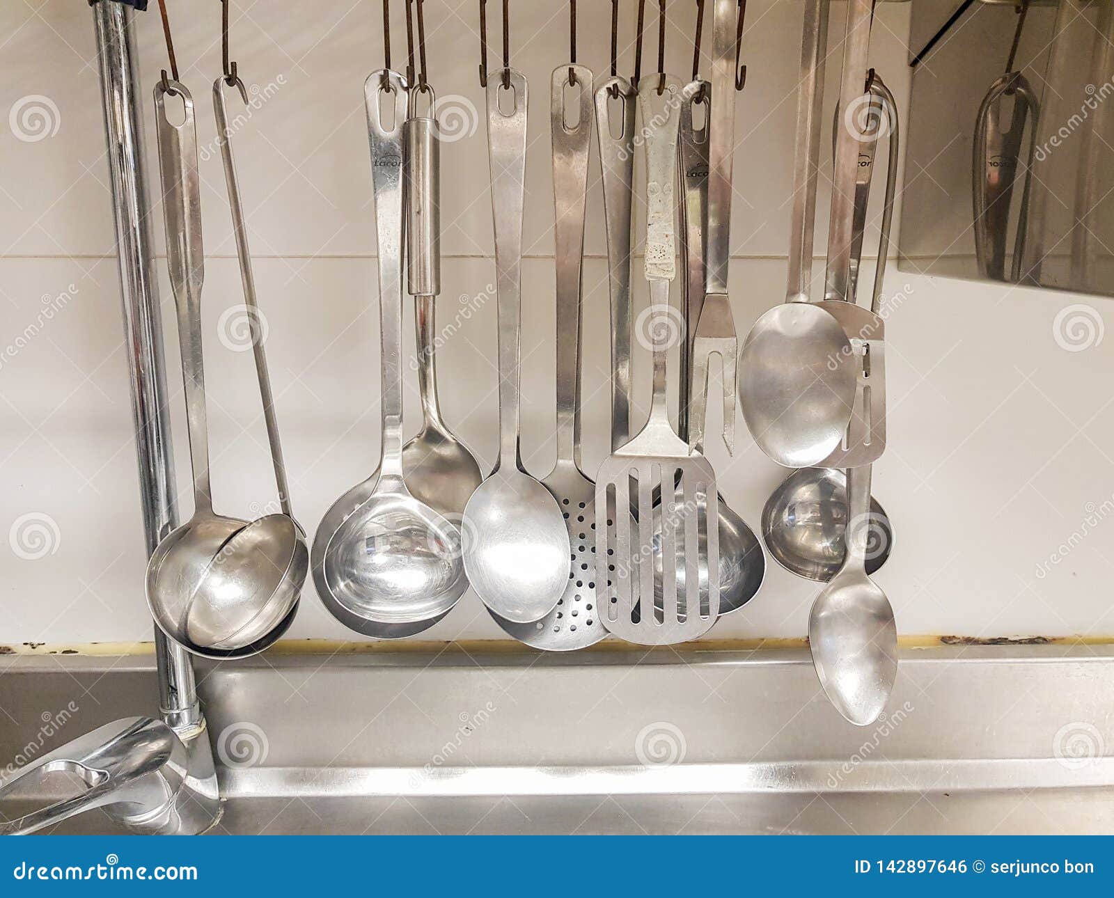 Kitchen Cooking Utensils on Steel Rack Stock Photo - Image of spatula ...