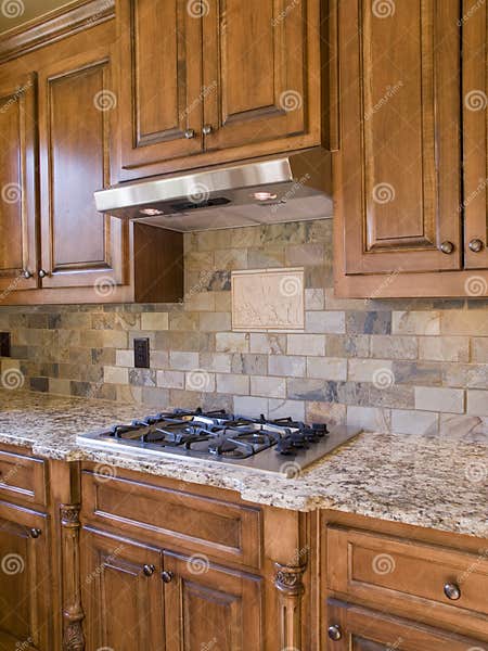 Kitchen Cooktop and Cabinets Angle View Stock Photo - Image of room ...