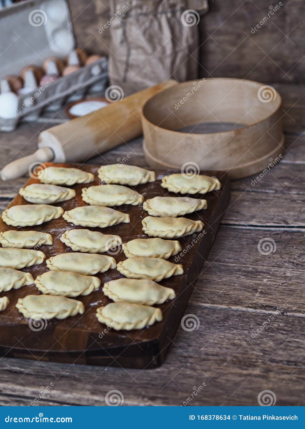 On the Kitchen Cutting Board, Ready-made Dumplings with Ingredients for ...