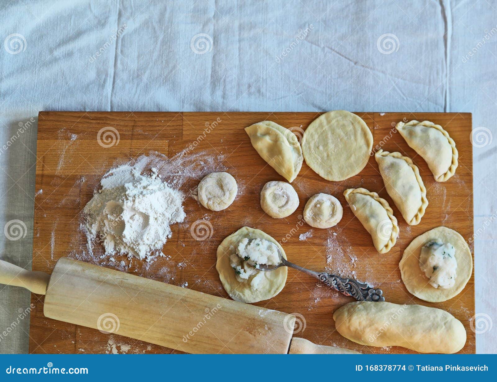 On the Kitchen Cutting Board, Ready-made Dumplings with Ingredients for ...