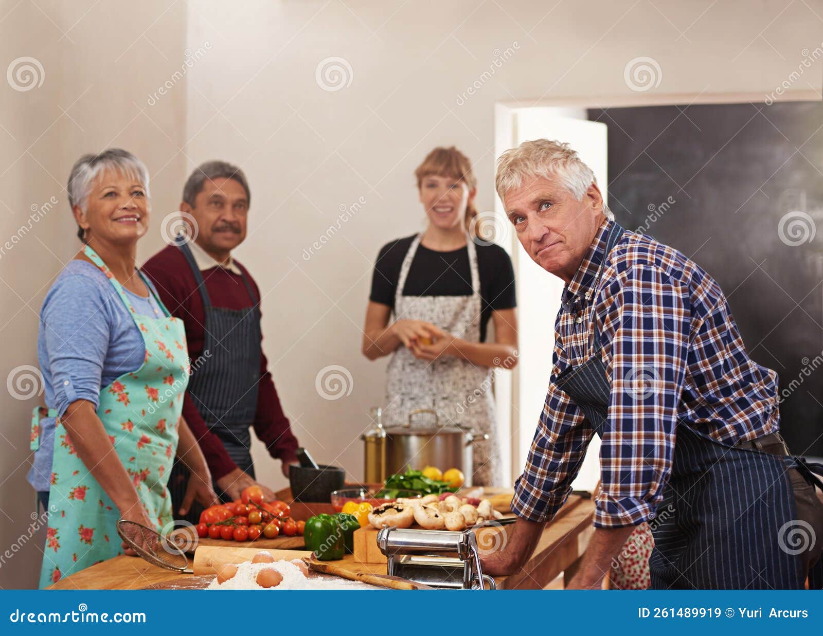 The Kitchen is a Gathering Place for Friends. a Group of People Cooking ...