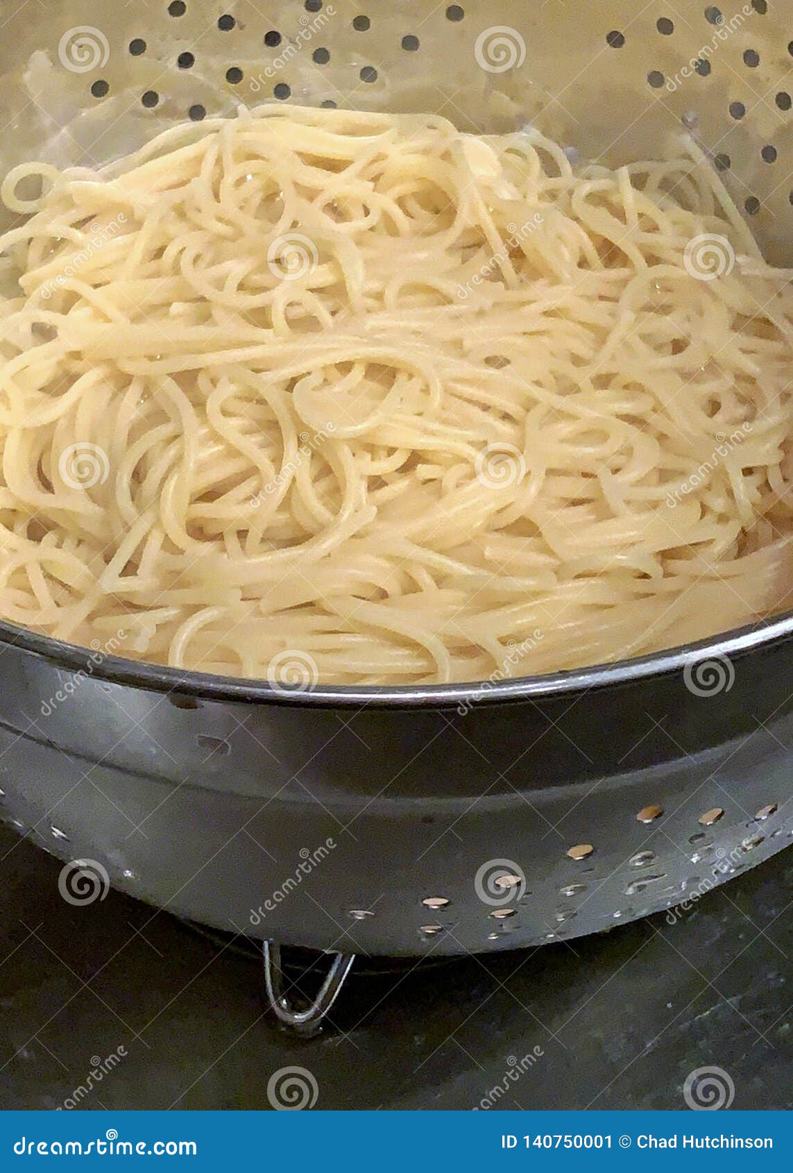 Colander of Steaming Hot Spaghetti Draining Stock Image - Image of ...