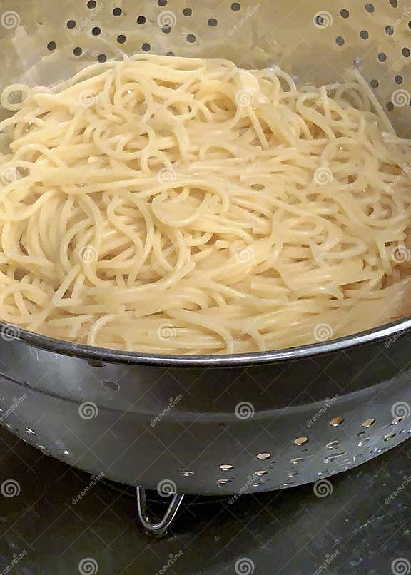 Colander of Steaming Hot Spaghetti Draining Stock Image - Image of ...