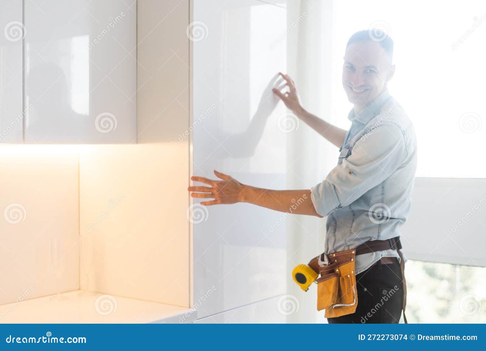Kitchen Installation. Worker Assembling Furniture. Stock Photo - Image ...