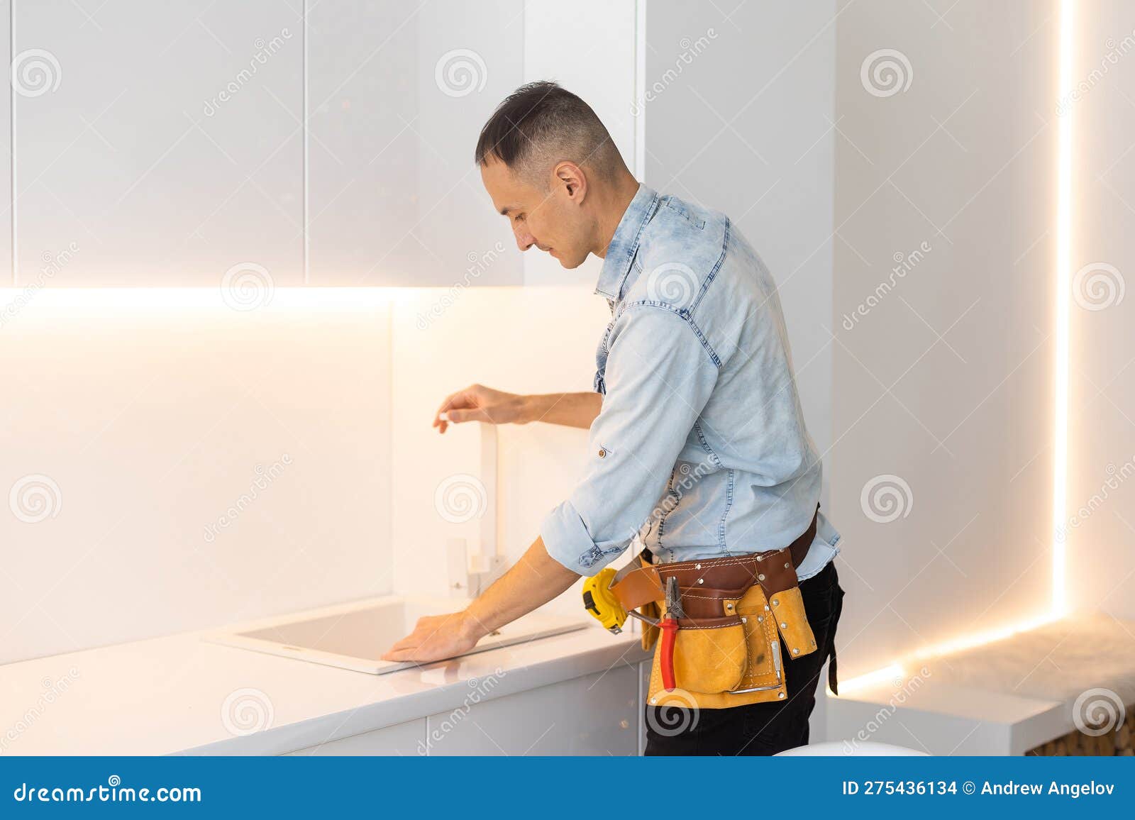 Kitchen Installation. Worker Assembling Furniture Stock Photo - Image ...