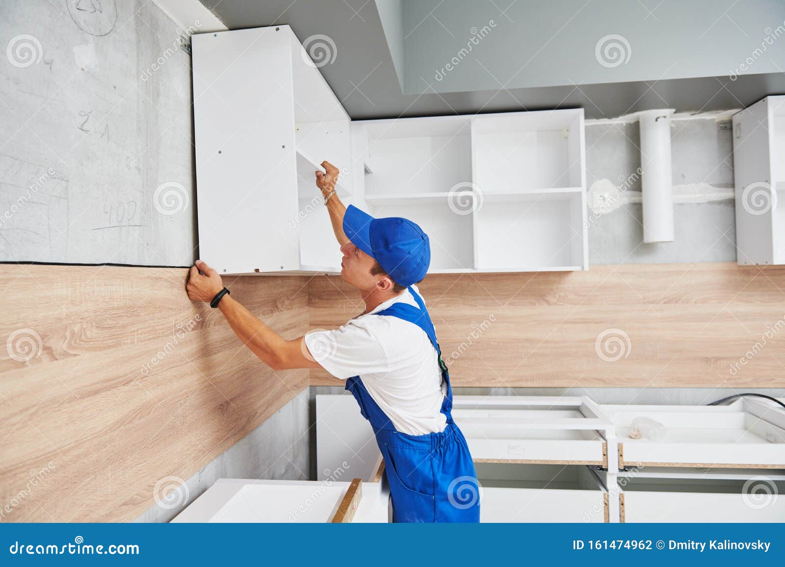 Kitchen Installation. Worker Assembling Furniture Stock Photo - Image ...