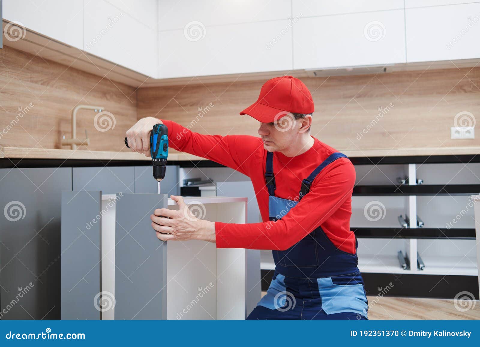 Kitchen Installation. Worker Assembling Furniture Stock Photo - Image ...