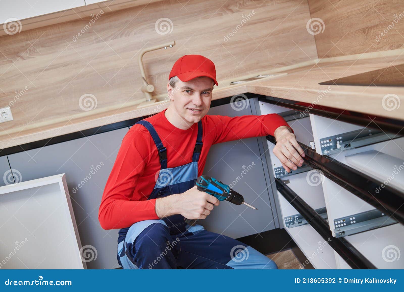 Kitchen Installation. Worker Assembling Furniture Stock Photo - Image ...