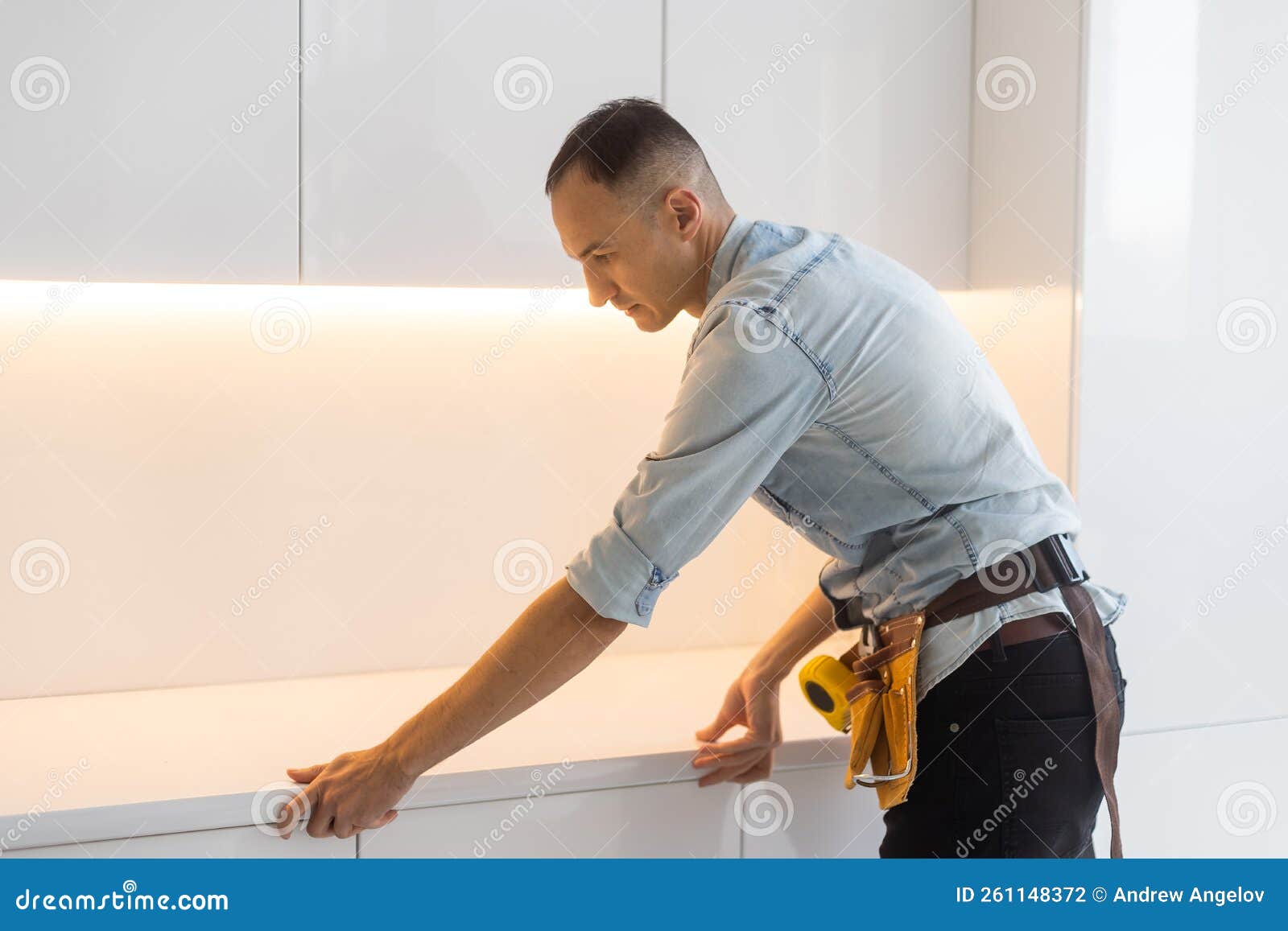Kitchen Installation. Worker Assembling Furniture. Stock Photo - Image ...