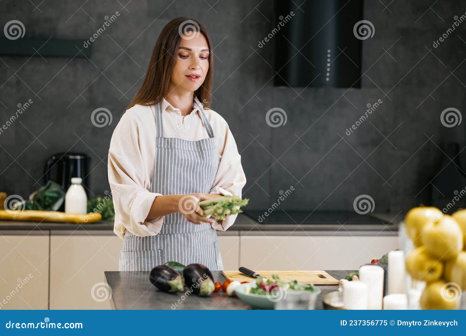 Long-haired Young Woman Preparing Lunch in the Kitchen Stock Image ...