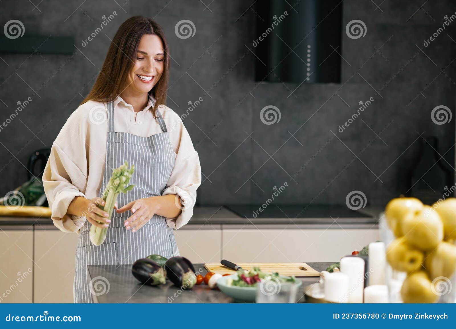 Long-haired Young Woman Preparing Lunch in the Kitchen Stock Photo ...