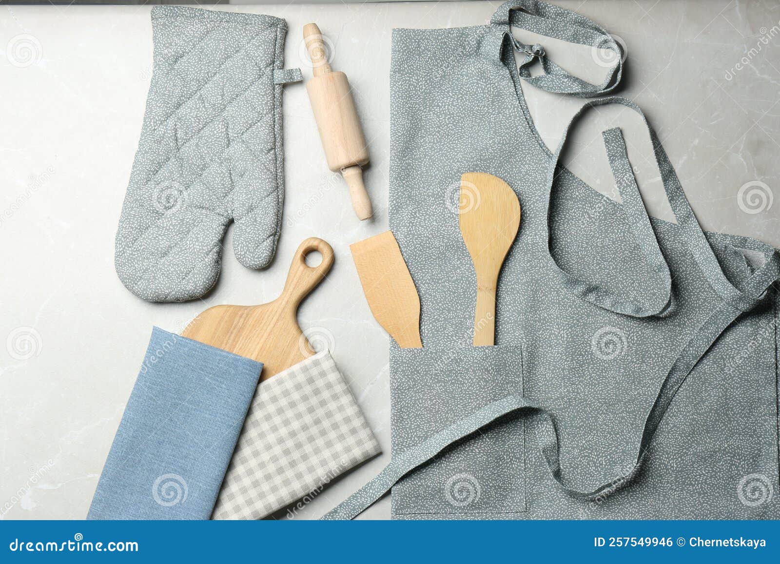 Kitchen Napkins, Apron and Different Utensils on Light Grey Table, Flat ...