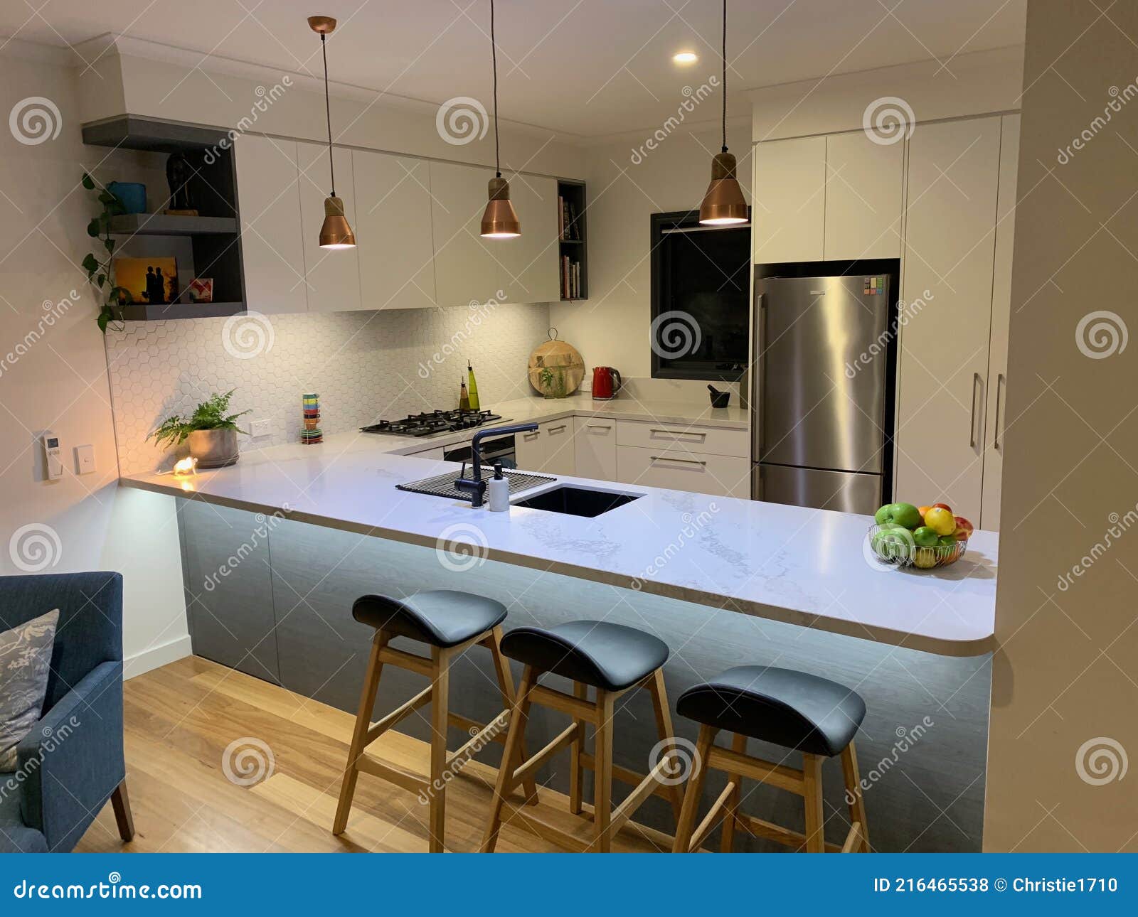 Kitchen with Pendant Lights and Breakfast Bench Stock Photo - Image of ...