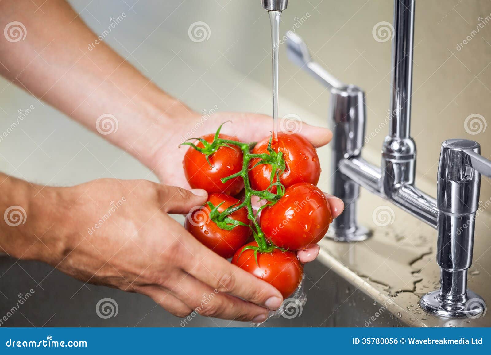 Kitchen Porter Washing Tomatoes Under Running Tap Stock Photo - Image ...