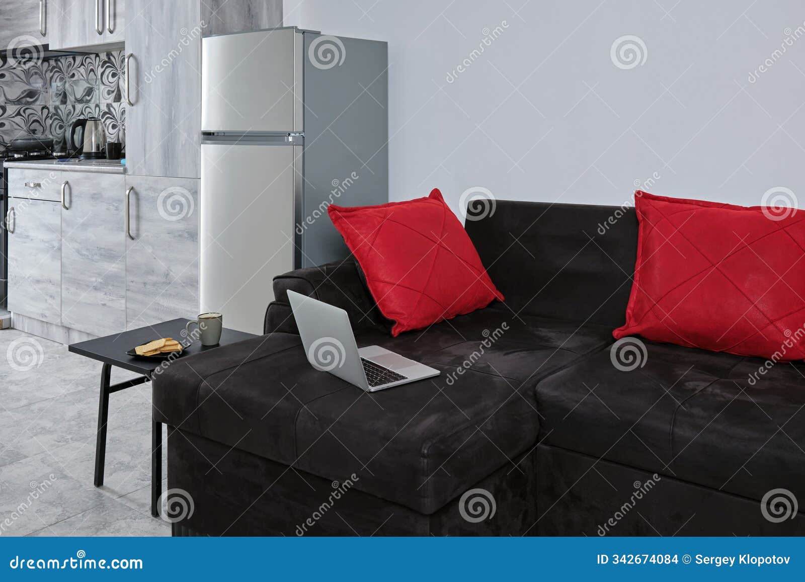 Kitchen, Refrigerator, Leather Sofa with Laptop Stock Photo - Image of ...