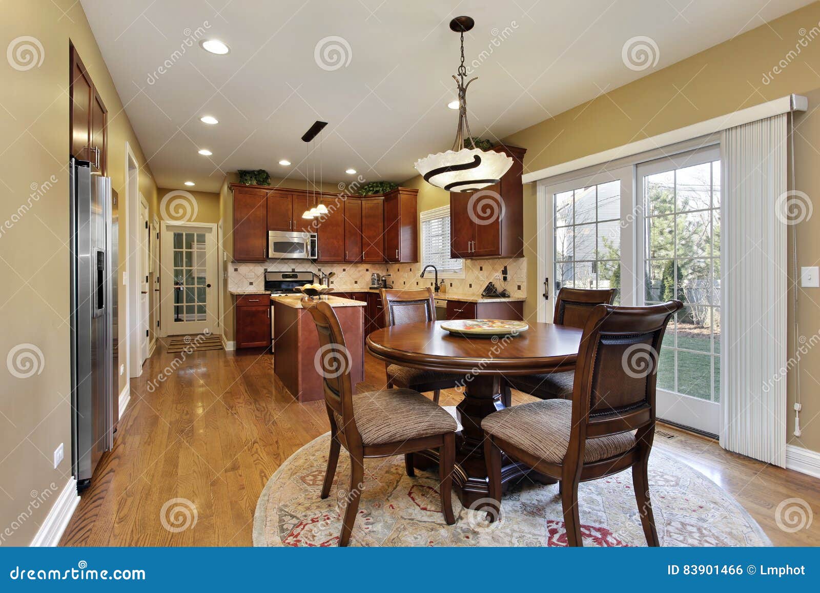 Kitchen with round table stock photo. Image of residence - 83901466