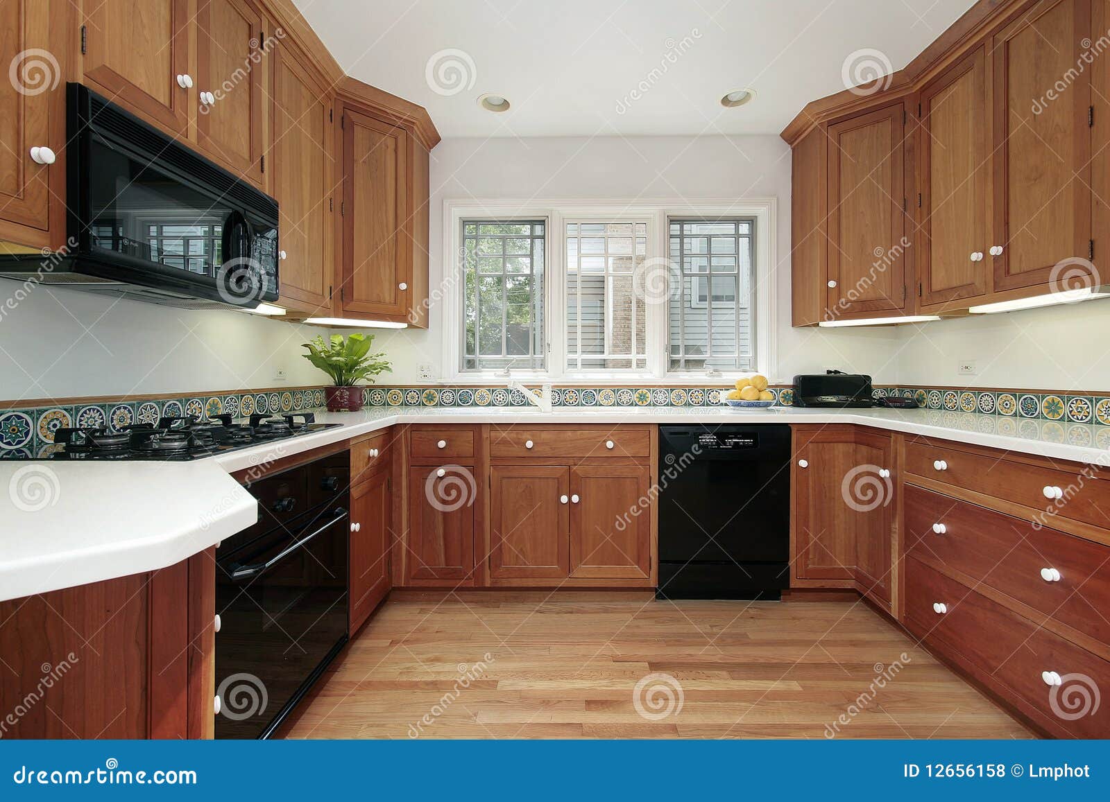 Kitchen in suburban home stock photo. Image of meal, cabinet - 12656158