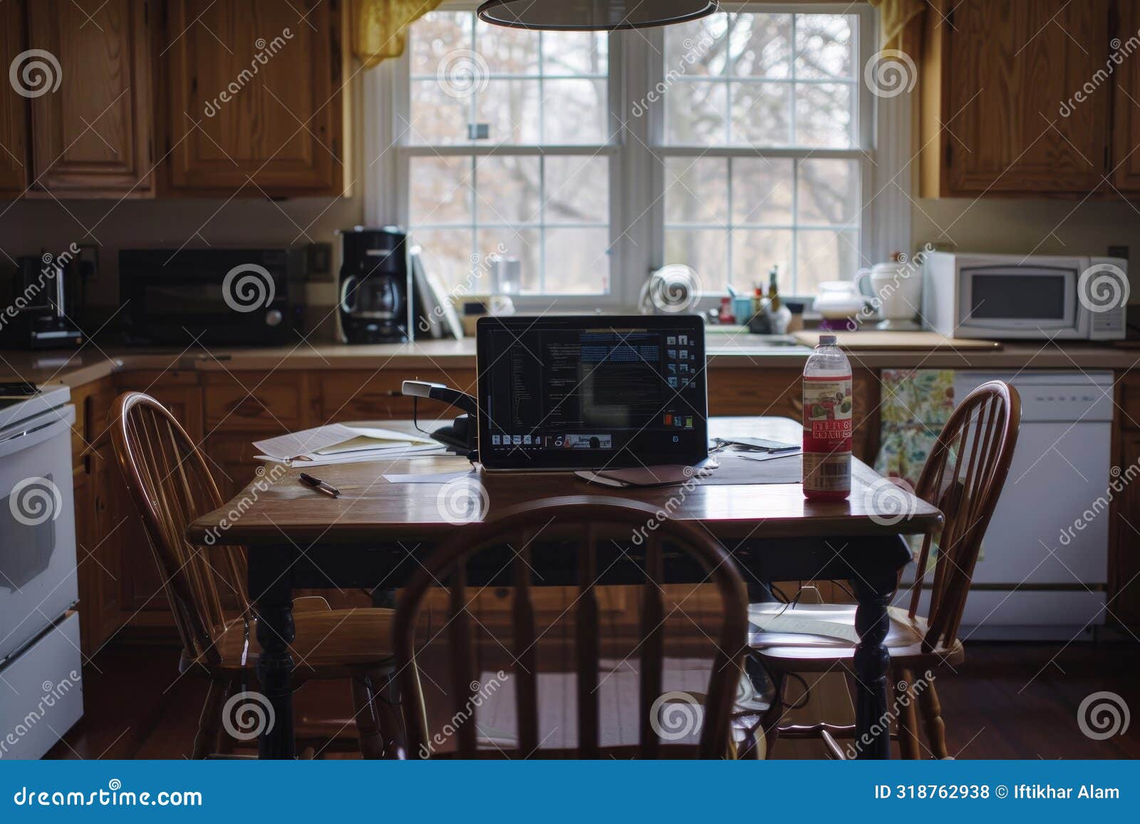 A Kitchen with a Table and Chairs Set Up for Dining, an Empty Kitchen ...