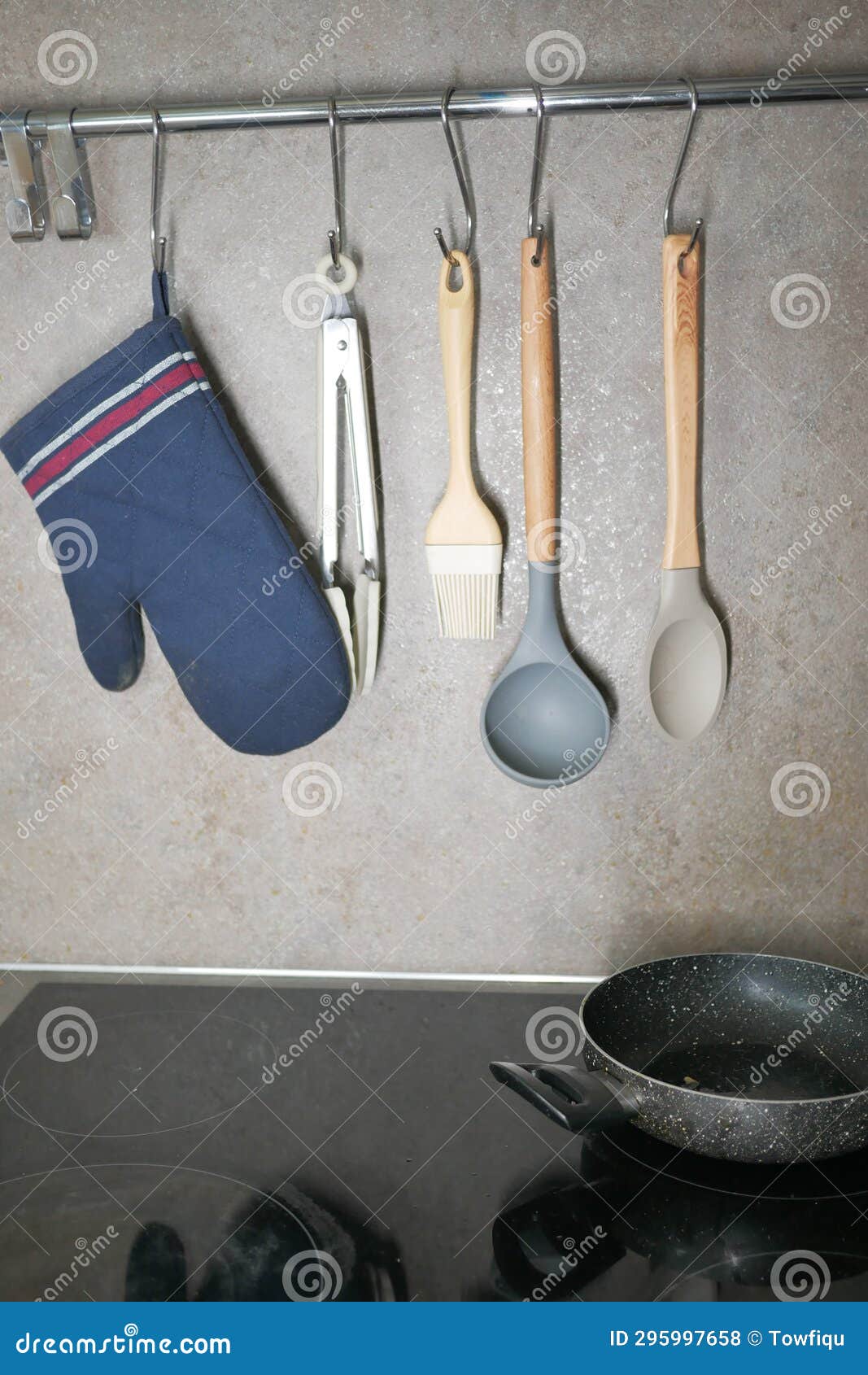 Kitchen Utensils Hanging on a Hanger Inside a Modern Kitchen, Stock ...
