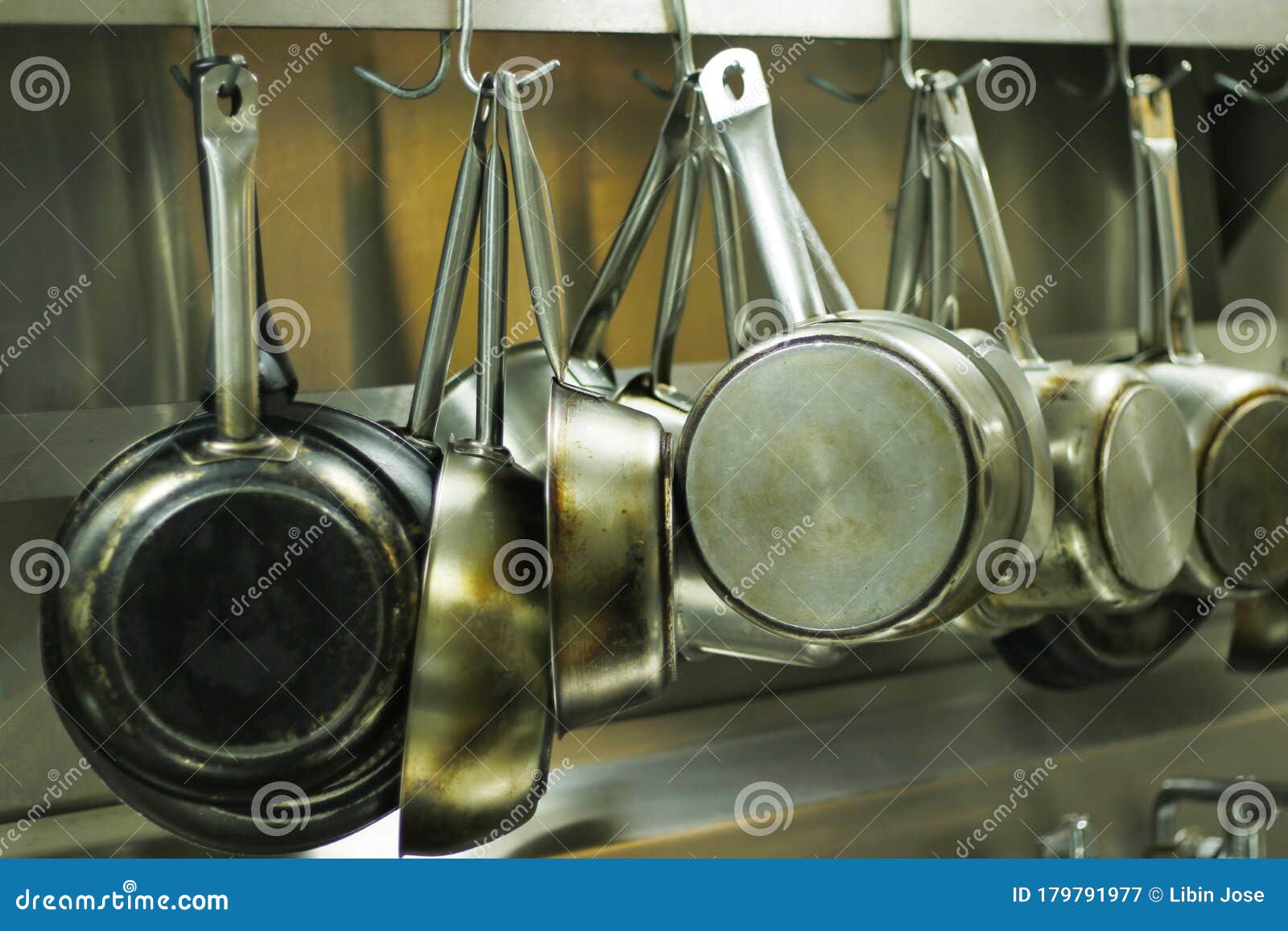 Kitchen Utensils, Pans and Pots Hanging with Hooks Stock Image - Image ...