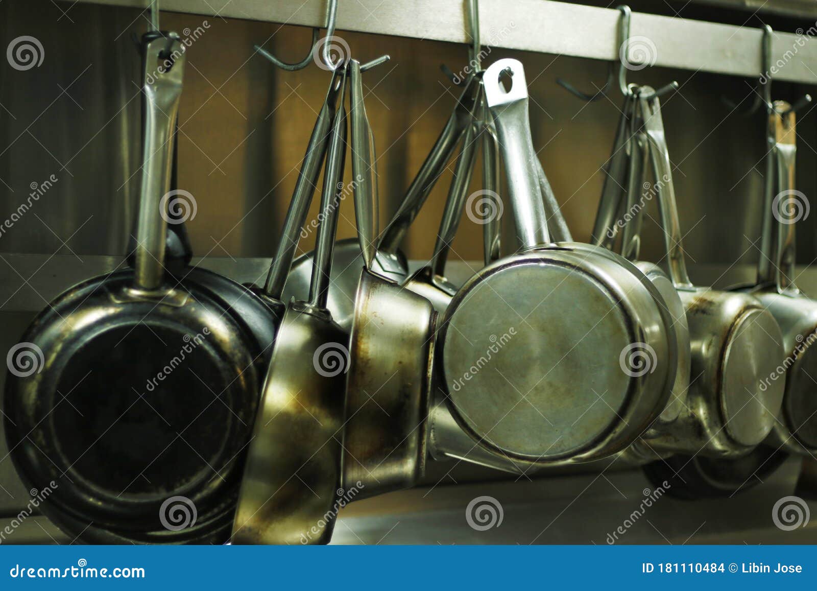 Kitchen Utensils, Pans and Pots Hanging with Hooks Stock Photo - Image ...