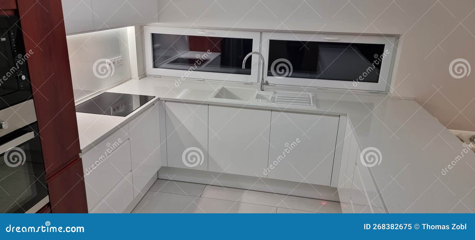 Kitchen, View of the Kitchen Counter, Sink and Induction Hob. Stock ...