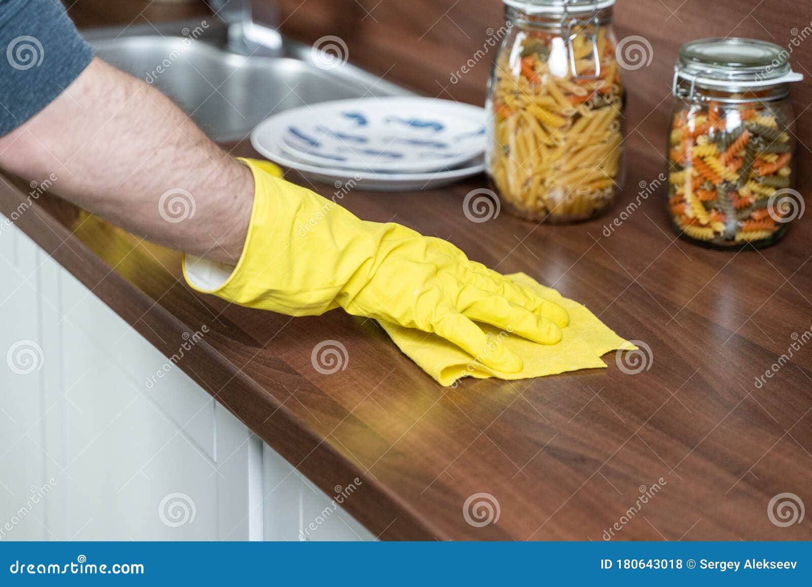 In the Kitchen they Wipe the Table in Yellow Gloves. Wipe the Table ...