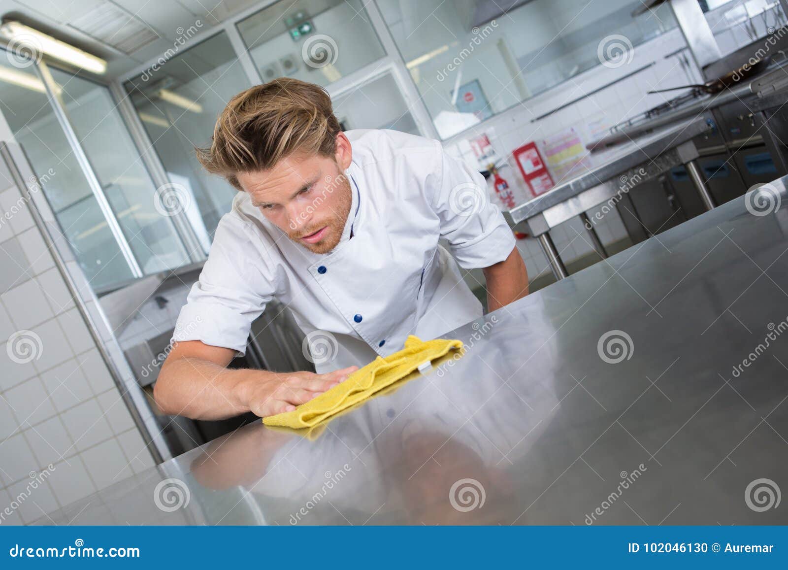 Kitchen Worker Wiping Station Stock Photo - Image of glove, service ...
