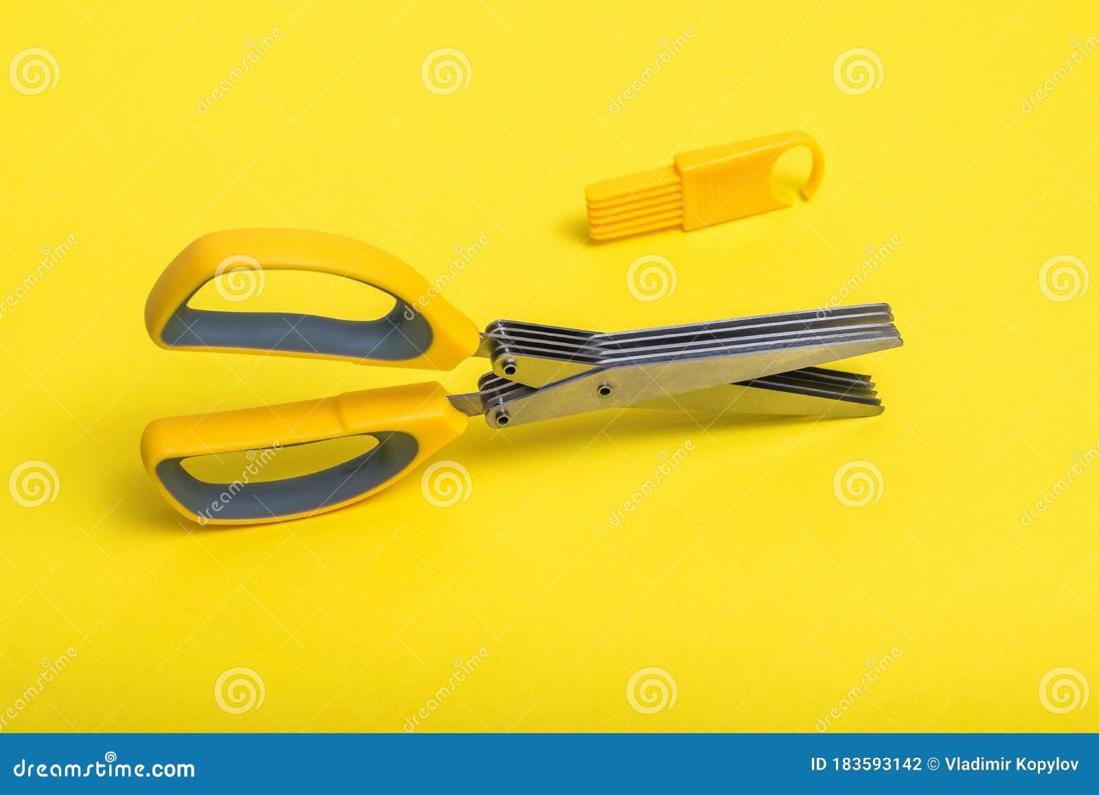 Kitchen Yellow Salad Clippers with a Cleaning Device on a Bright Yellow ...