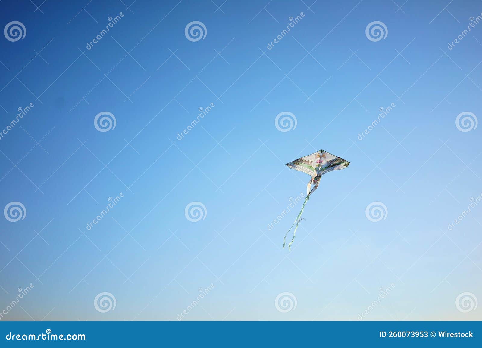 Kite flying in a blue sky stock image. Image of space - 260073953