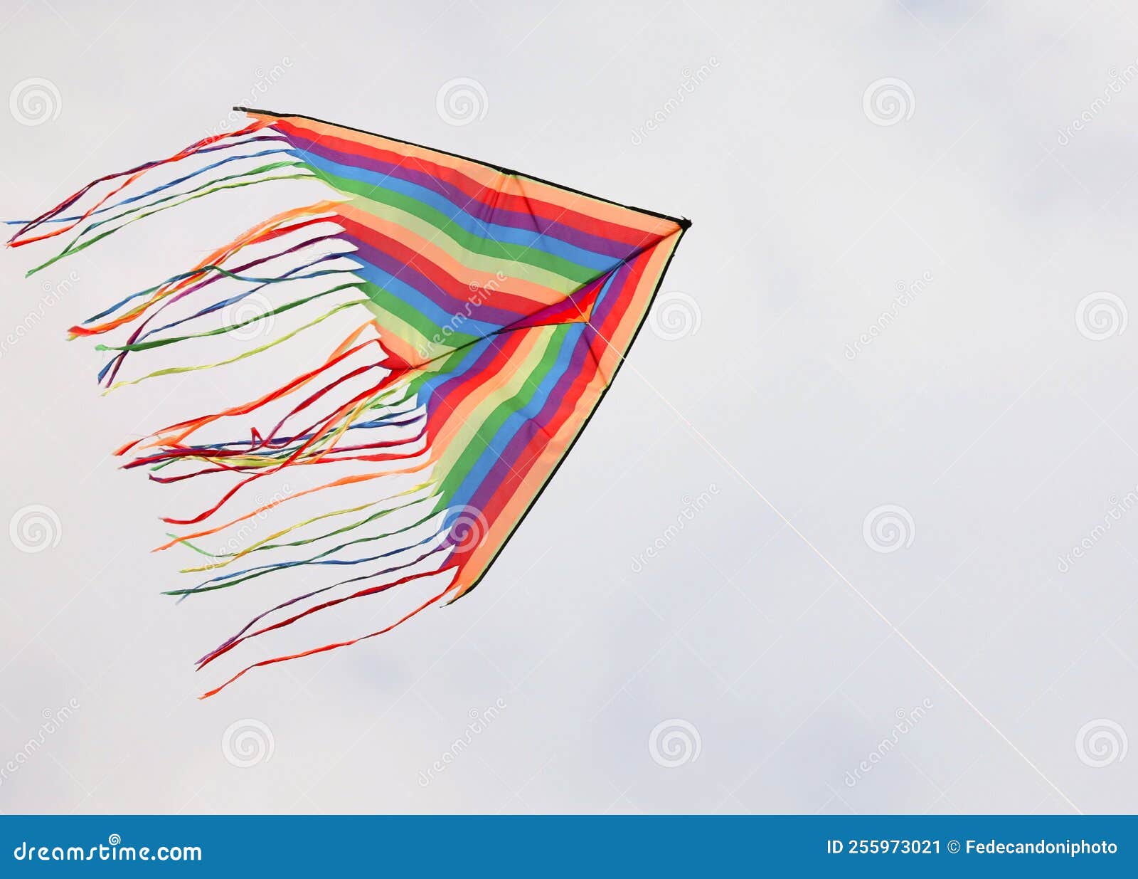 Kite with the Many Colors of the Rainbow Flying High Stock Image ...