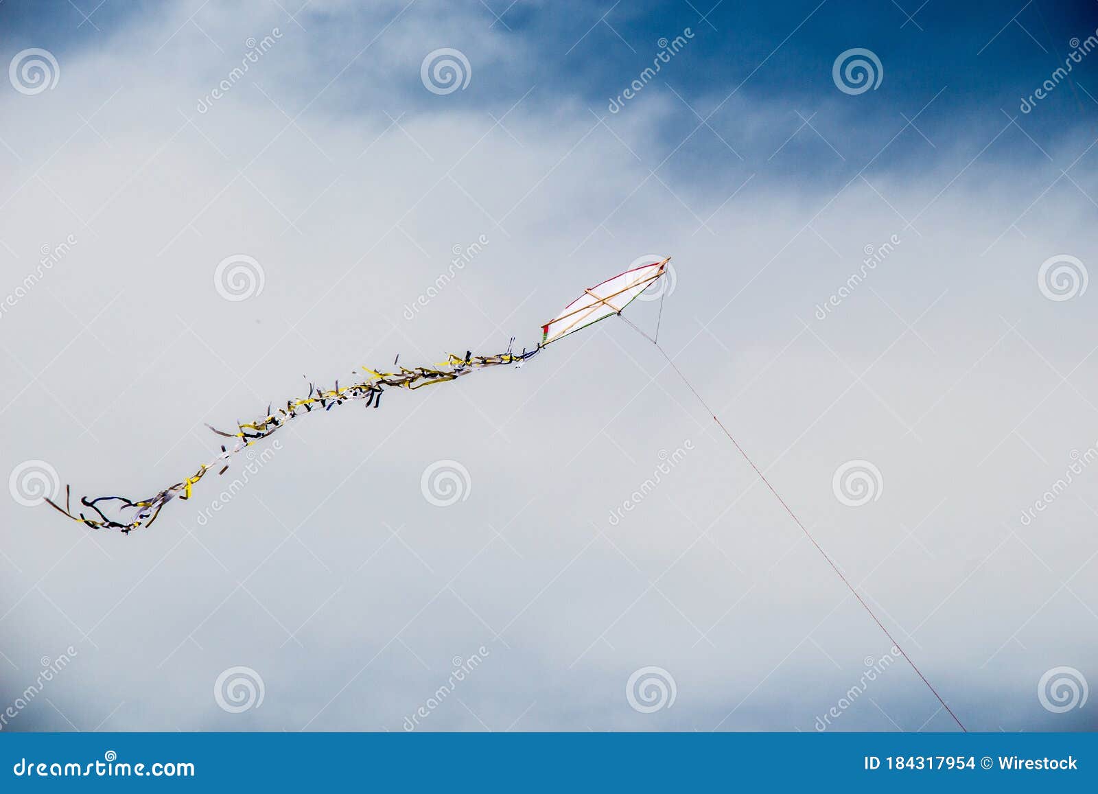 Kite in the Sky Covered by the White Clouds Stock Photo - Image of ...