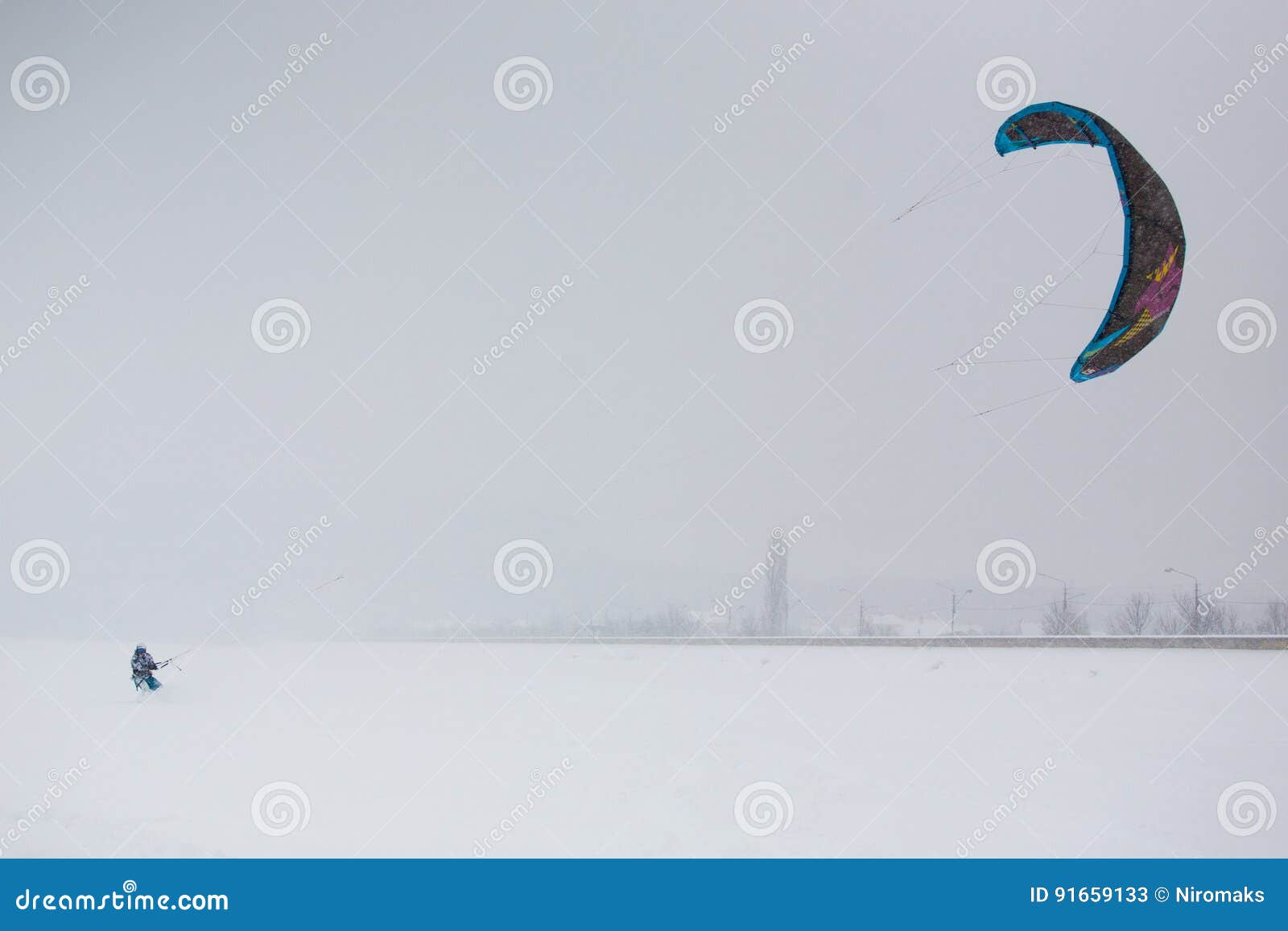 Kite Surfer Being Pulled by His Kite Across the Snow Stock Image ...