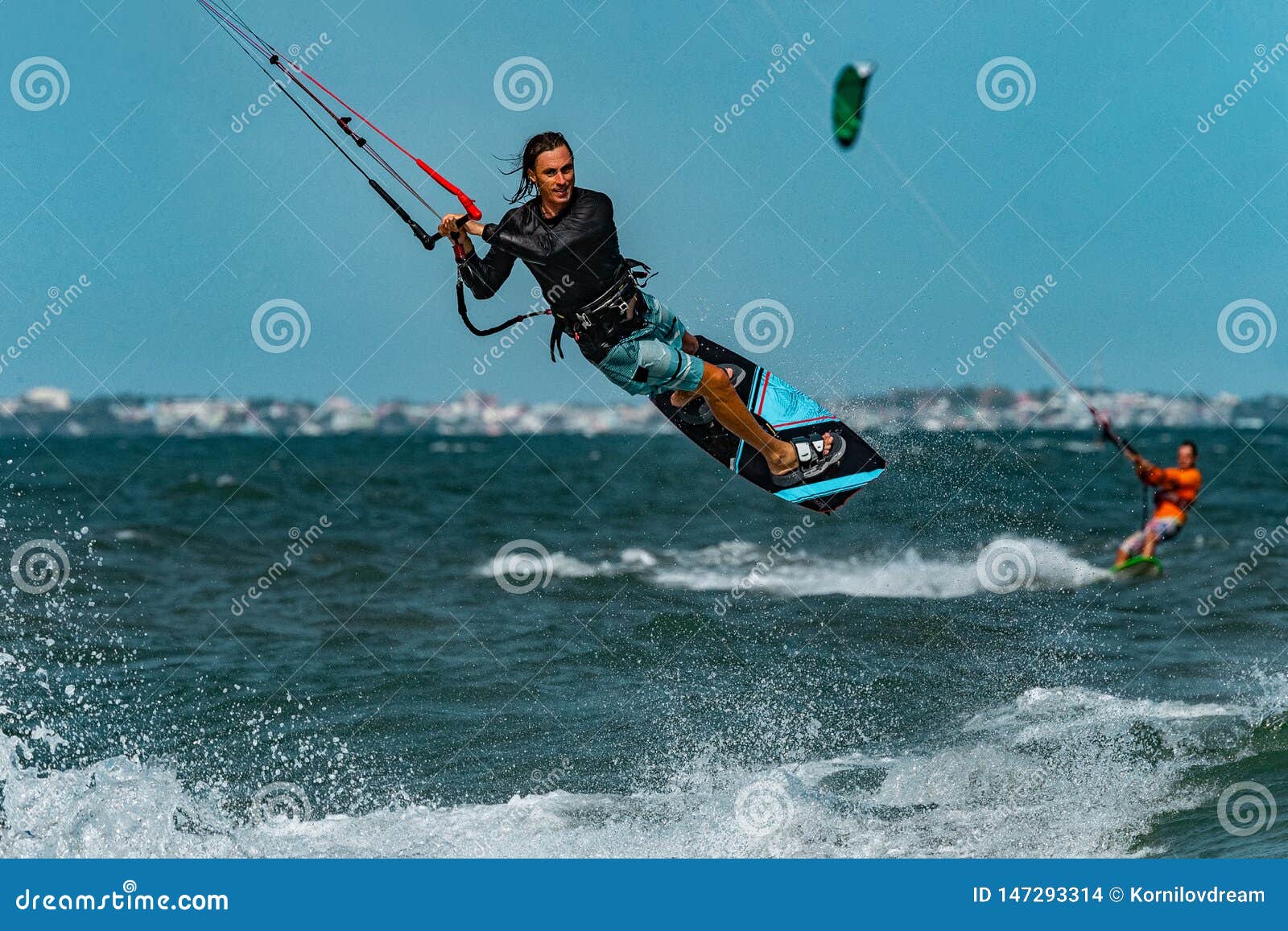 Kiter rides board stock photo. Image of surfing, surfer - 147293314