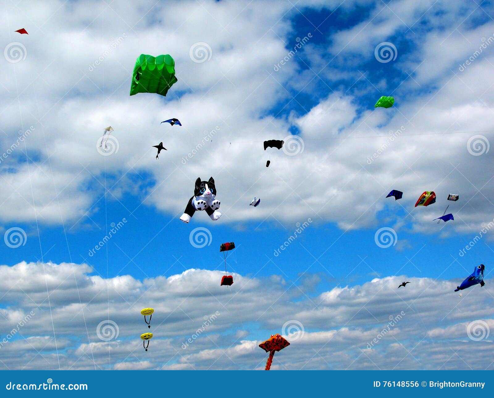 Kites in a bright blue sky stock photo. Image of summer - 76148556