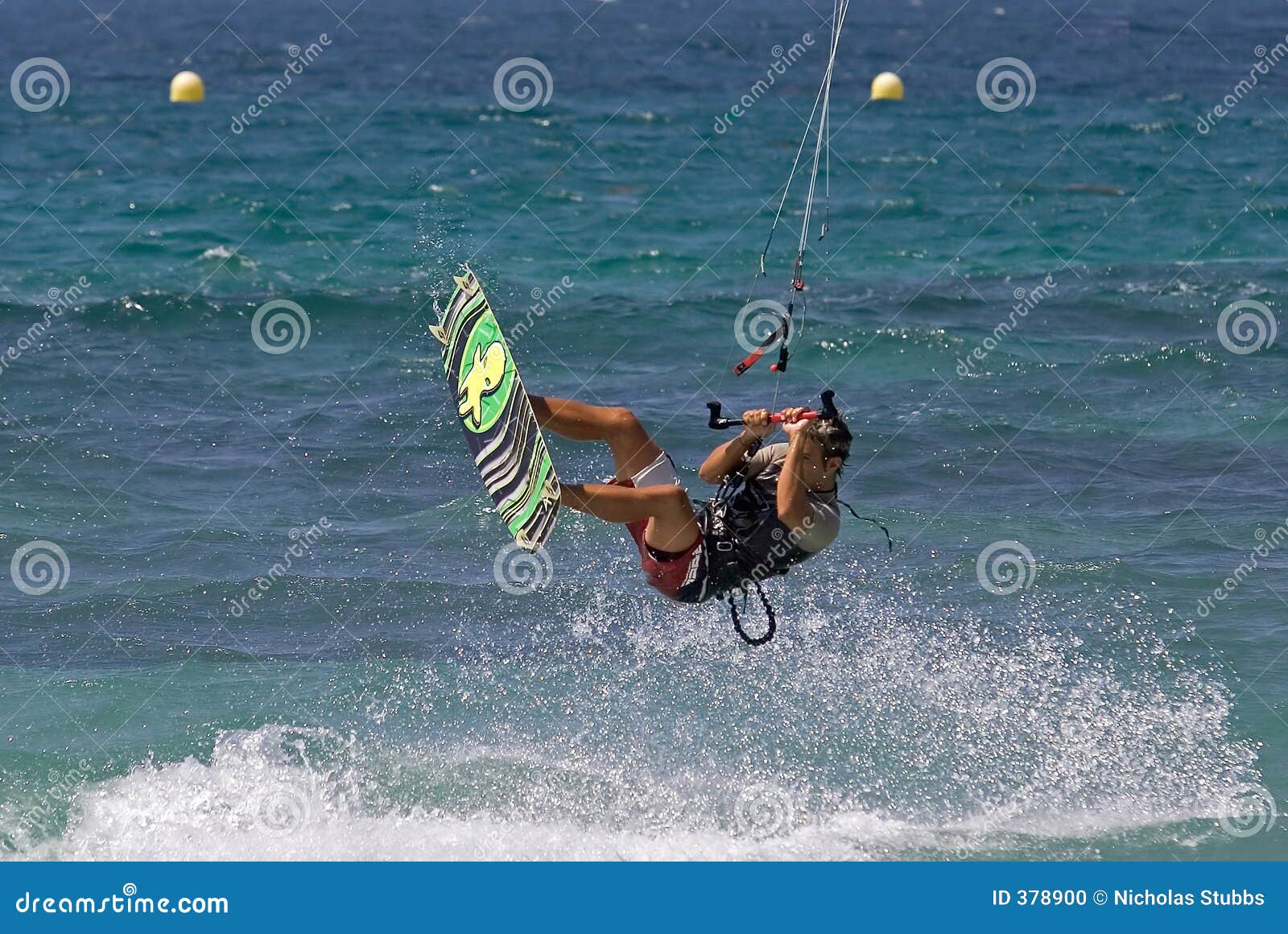 Kitesurfer Flying through the Air on a Sunny Beach Stock Photo - Image ...