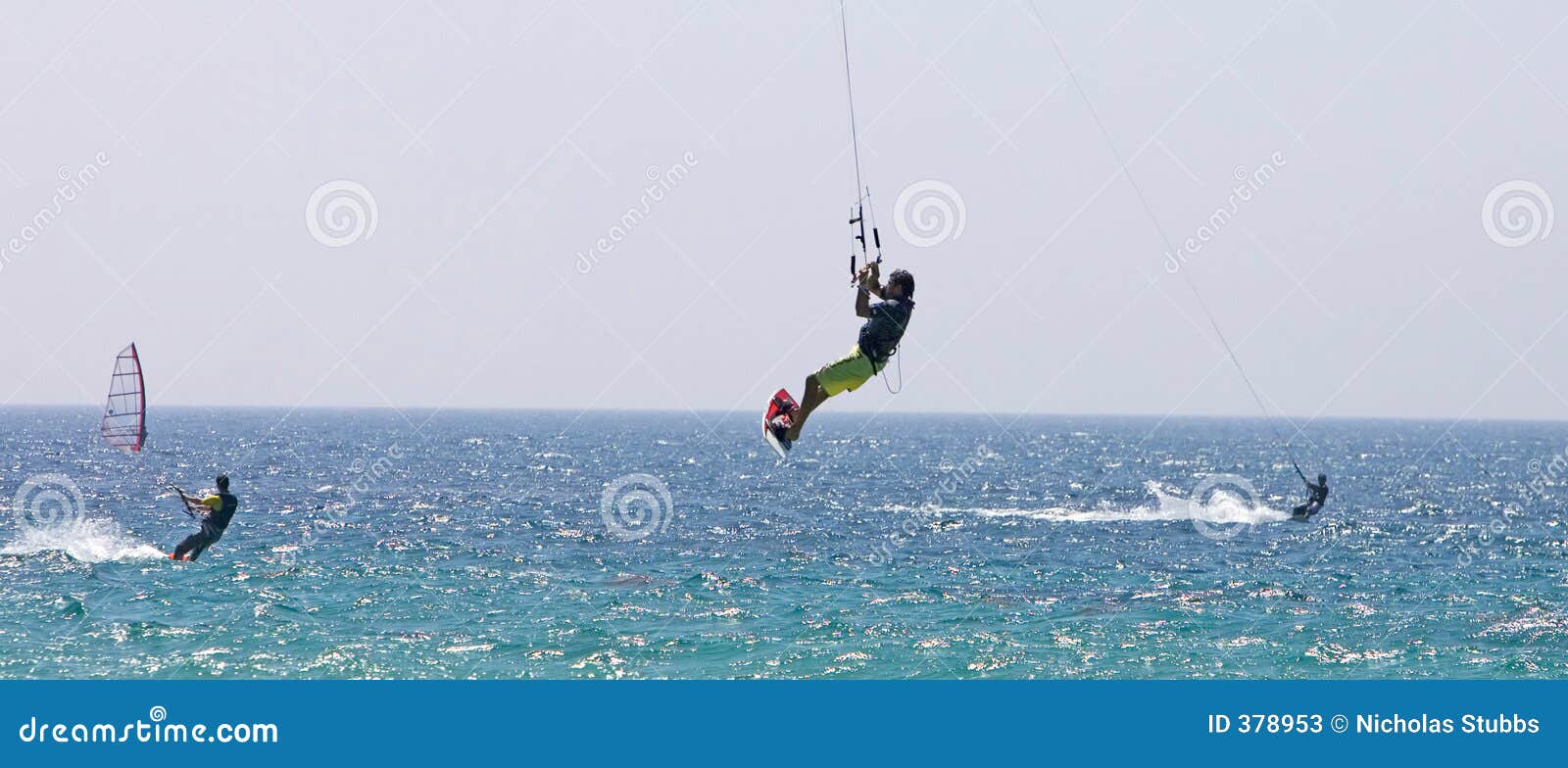 Kitesurfer Flying through the Air on a Sunny Beach Editorial Stock ...