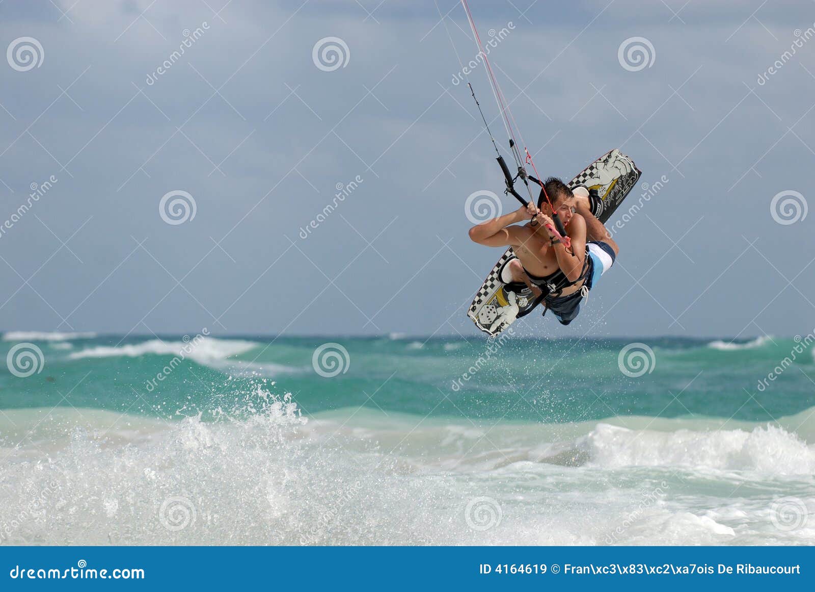 Kitesurfer jumping waves stock image. Image of kiteboarder - 4164619