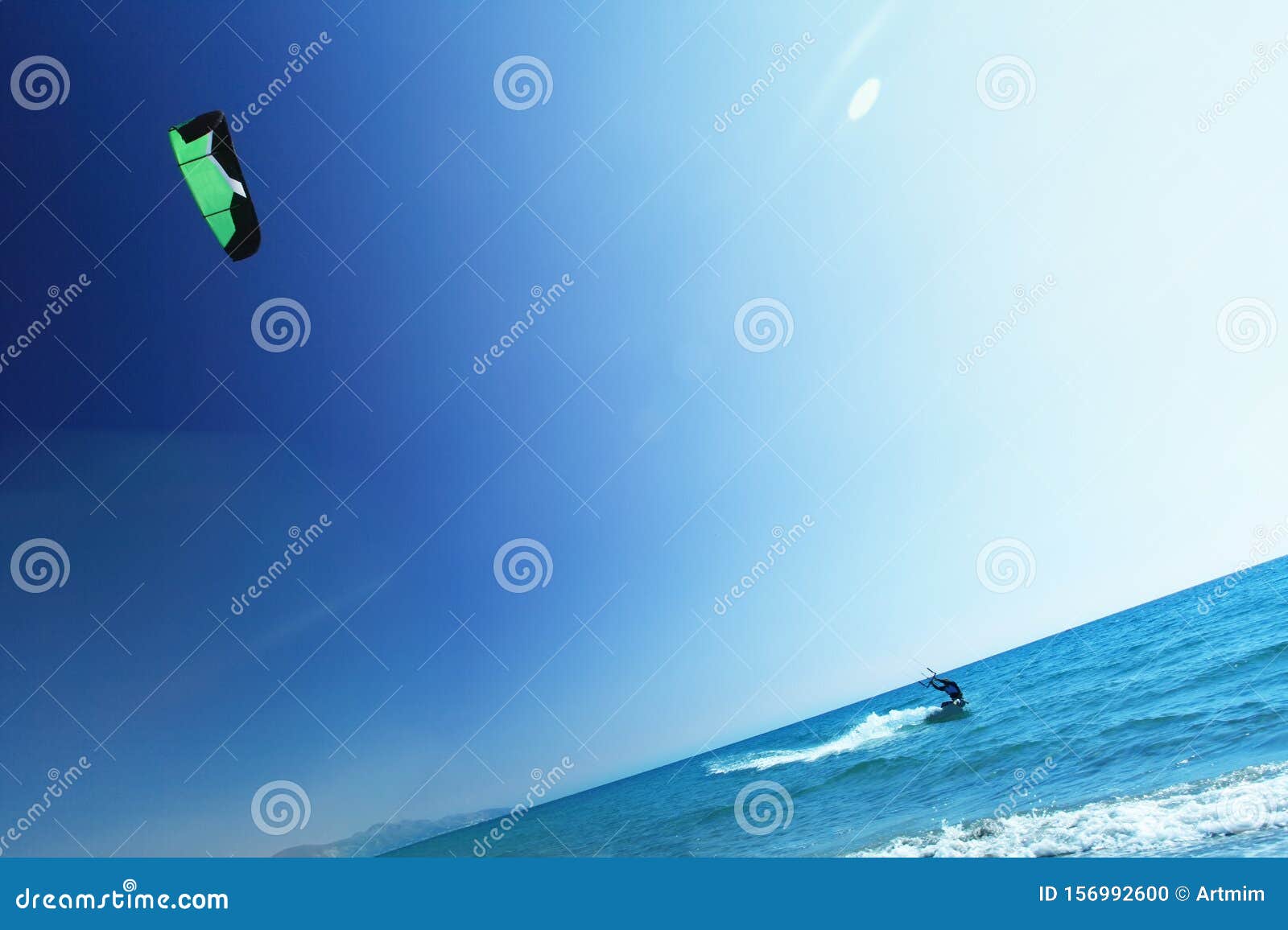 Kitesurfing Jumping Over a Wave with a Parachute Stock Photo - Image of ...