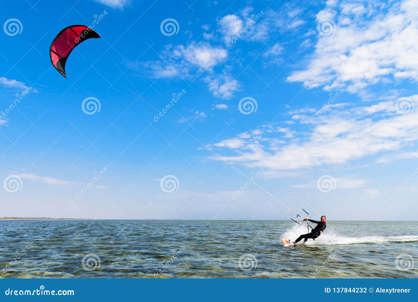 Kitesurfing. Man Rides a Kite in the Sea Stock Photo - Image of sports ...