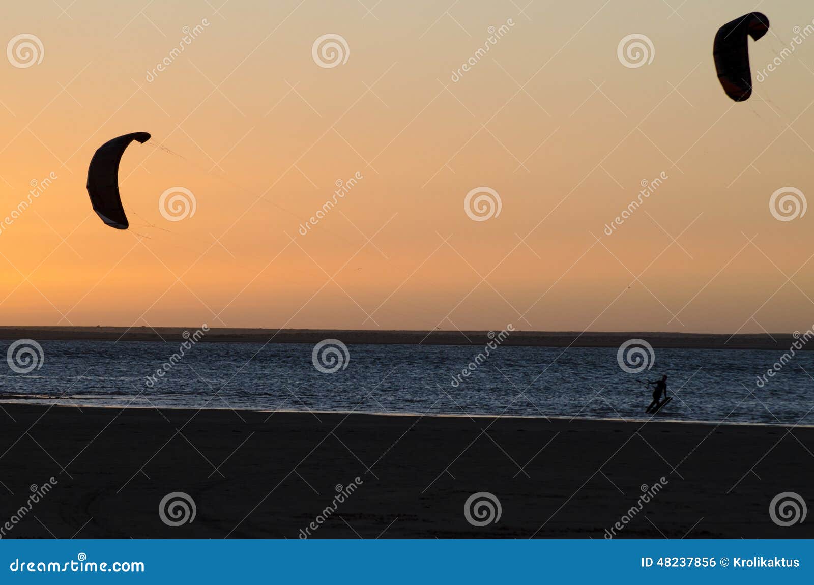 Kitesurfing at sunset stock photo. Image of dynamic, boarding - 48237856